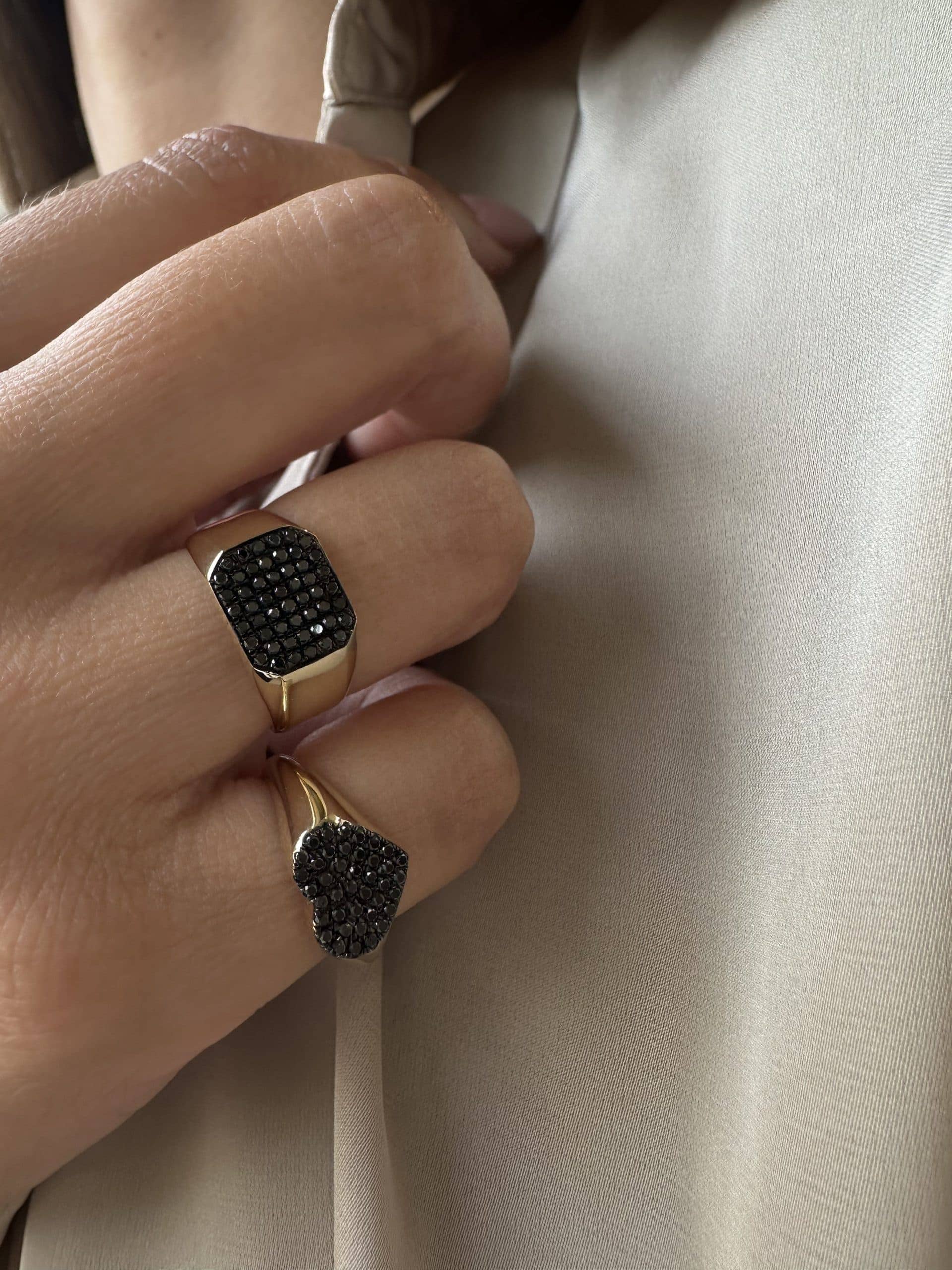 Black ring on pinky finger store